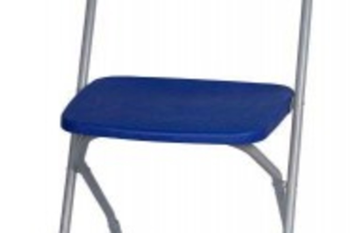 Green sits in Hawking's chair | Discover Magazine